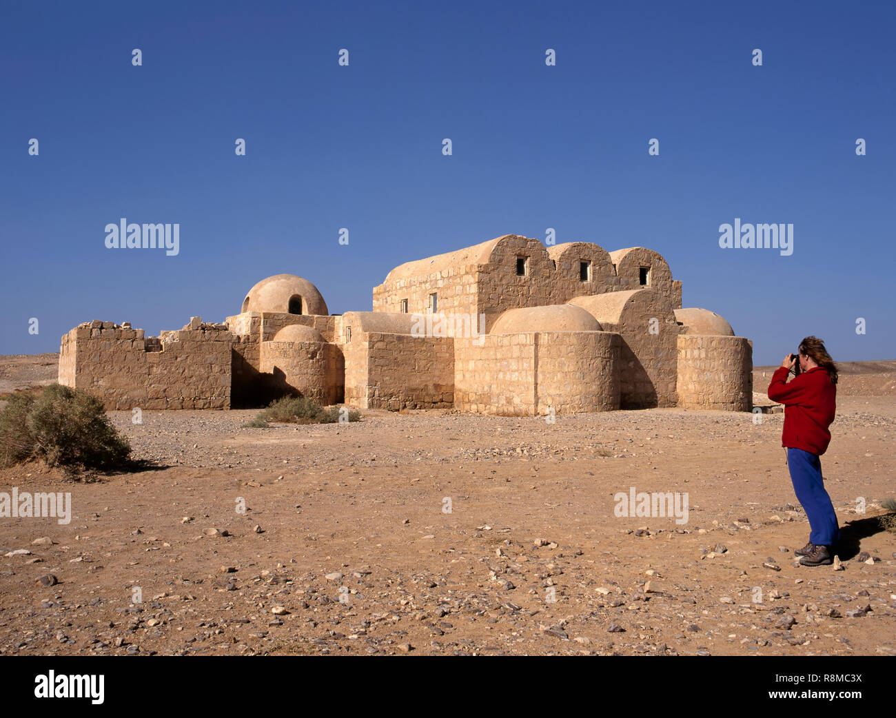 Qasr Amra, Jordan-May 12,2009:Tourist taking a photo of the Amra desert ...