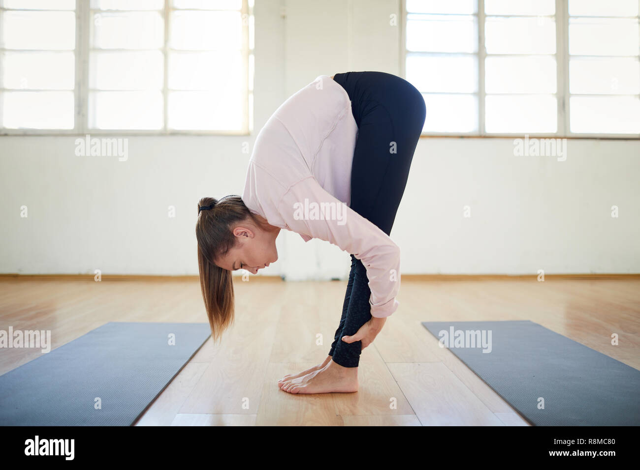 Bending forwards hi-res stock photography and images - Alamy