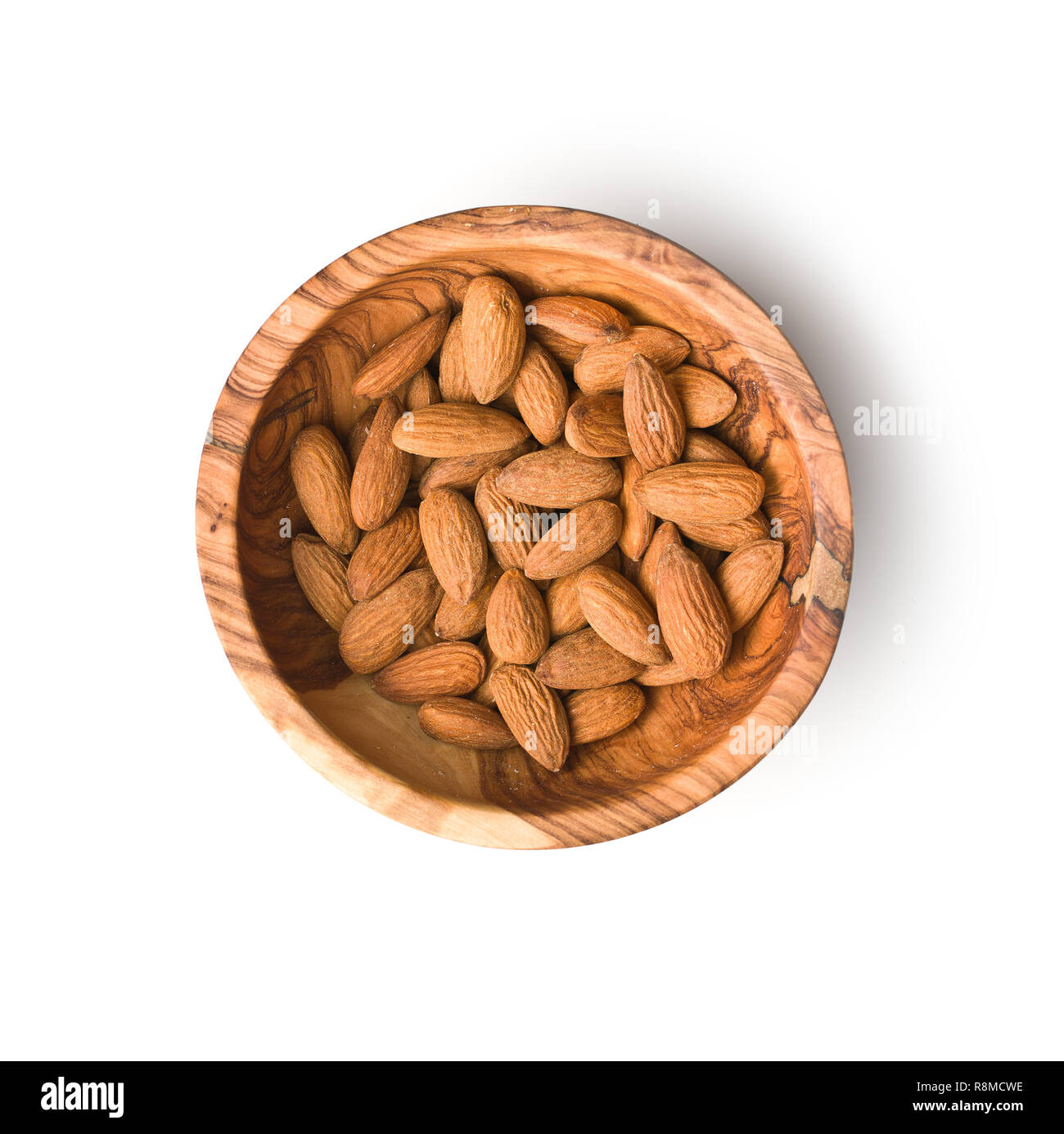 Dried almond nuts in bowl isolated on white background Stock Photo - Alamy