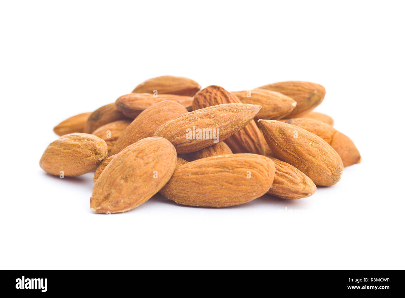 Dried almond nuts isolated on white background Stock Photo - Alamy