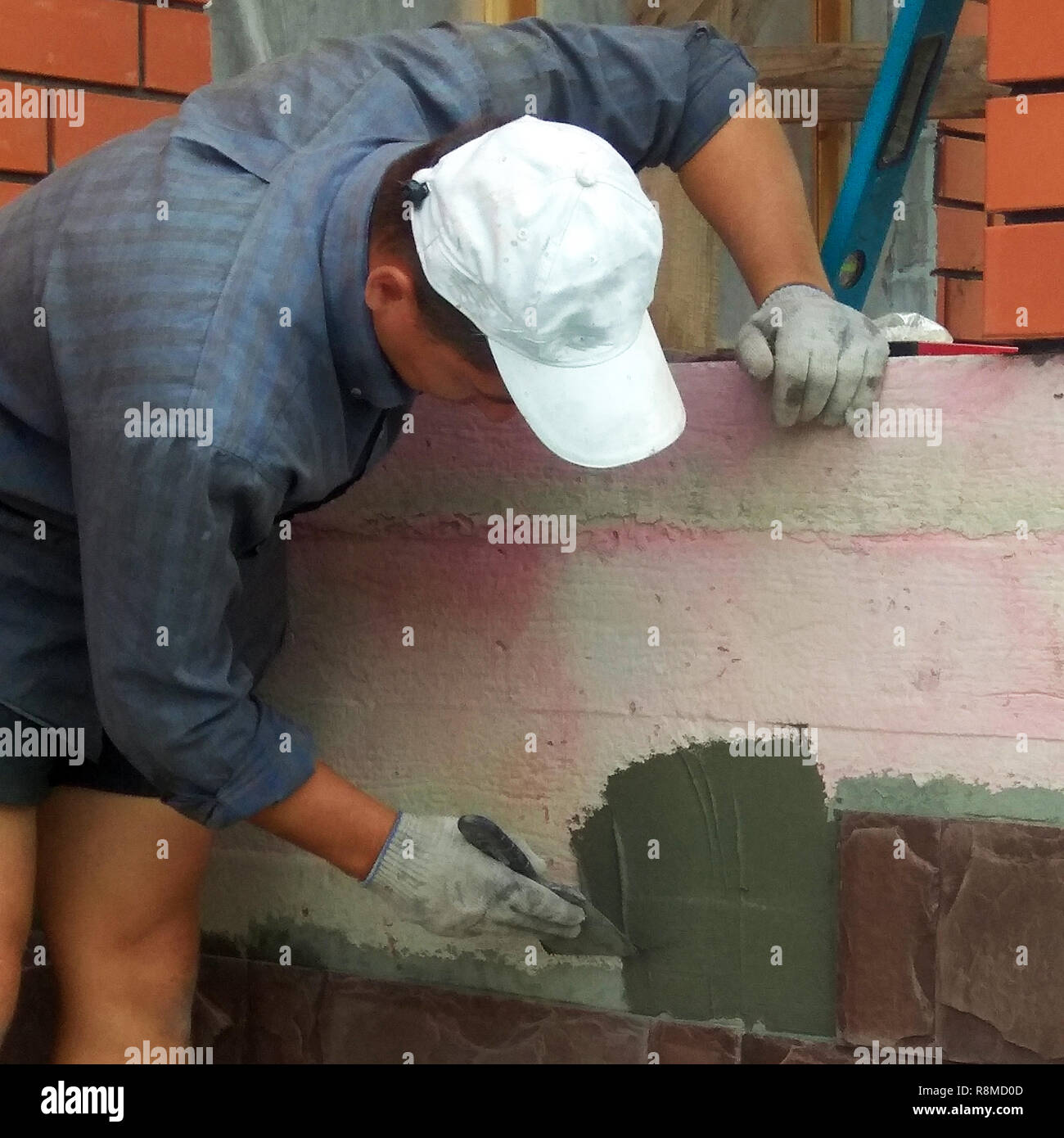 Gluing tiles hi-res stock photography and images - Alamy