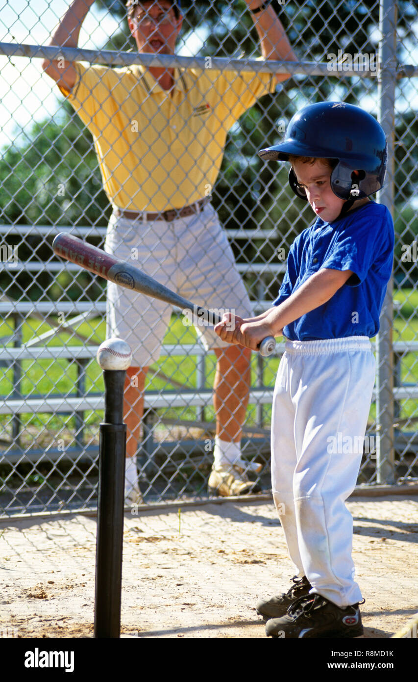 Dad Teaching Son to Bat in T-ball game, USA Stock Photo - Alamy