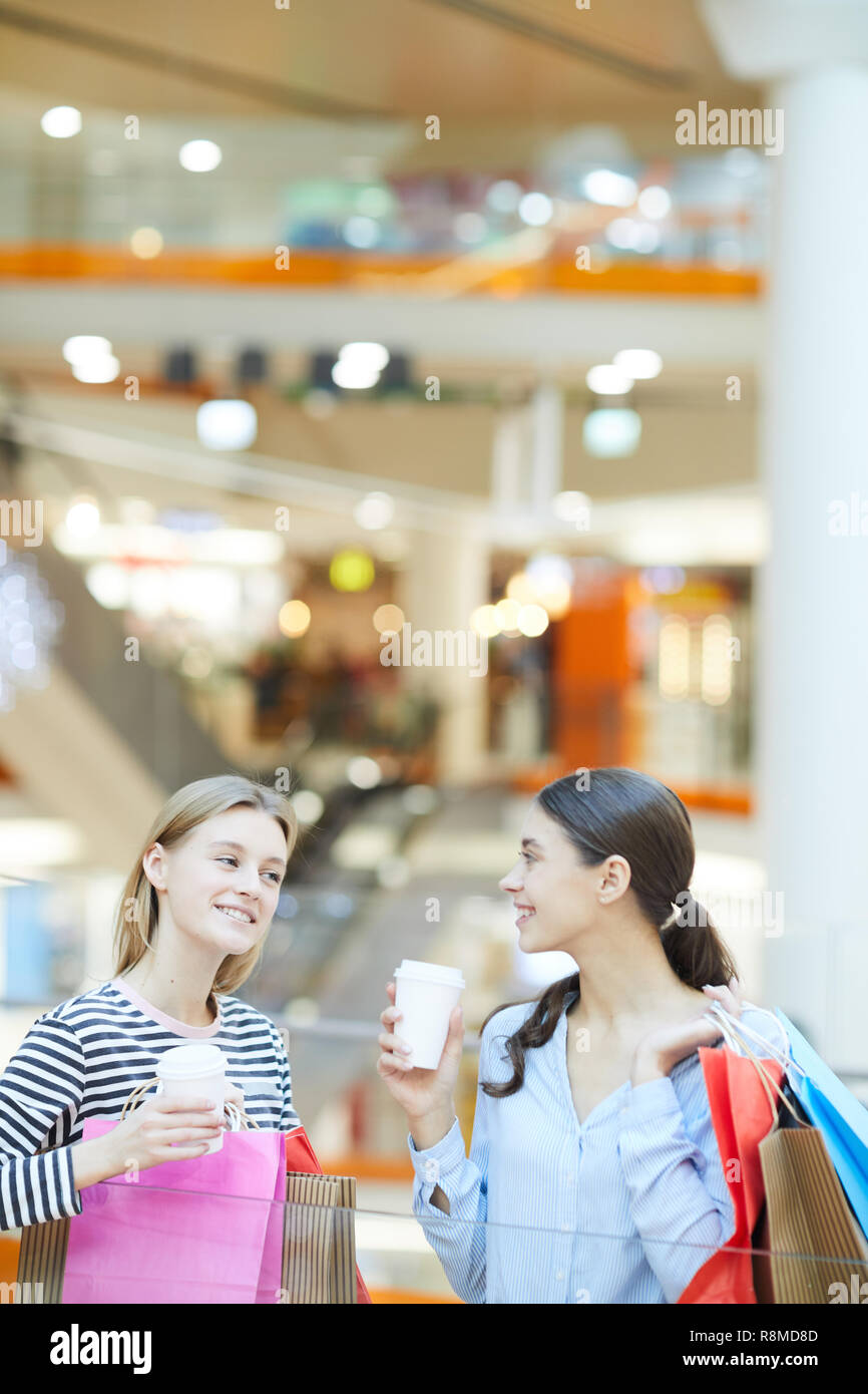 Shoppers with drinks Stock Photo - Alamy