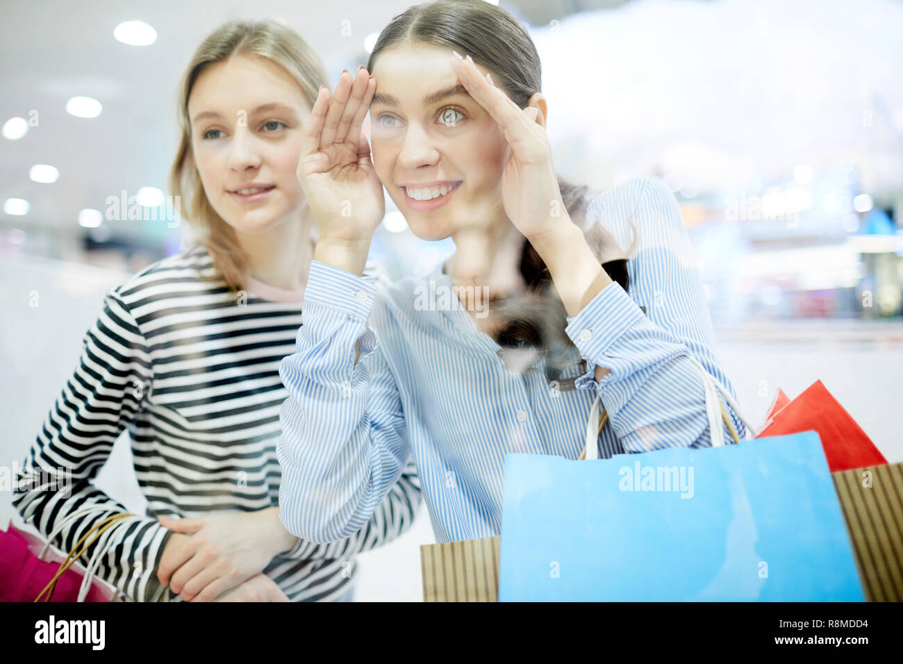 Peering in window woman hi-res stock photography and images - Alamy