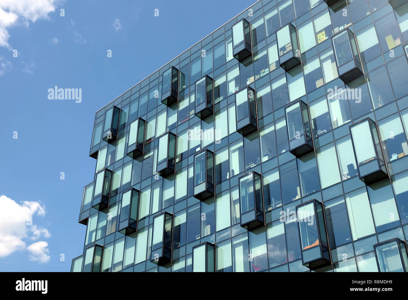 Glass wall of modern office building with many large panoramic windows ...