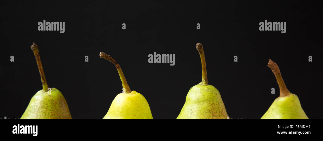 Fresh organic pears over black background, side view. Close-up. Organic ...