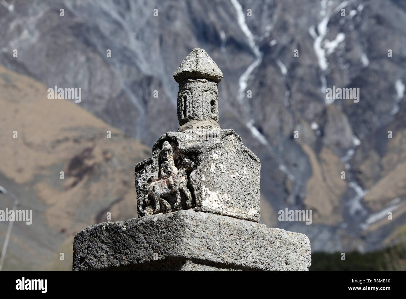 Stone sculpture outside Alexander Kazbegi Church at Stepantsminda in ...