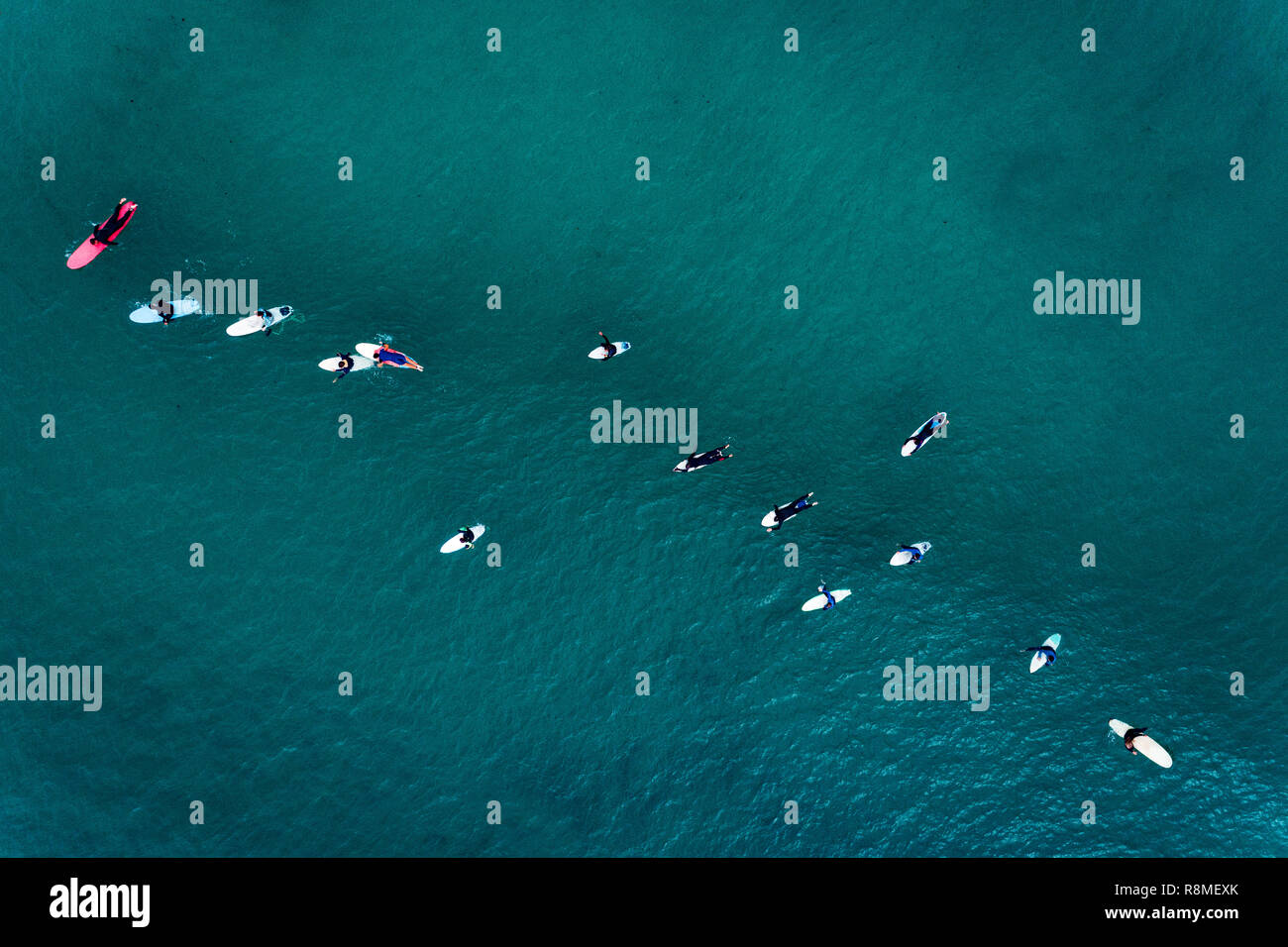 Aerial view of surfers in the ocean at the Baleal beach in Peniche ...