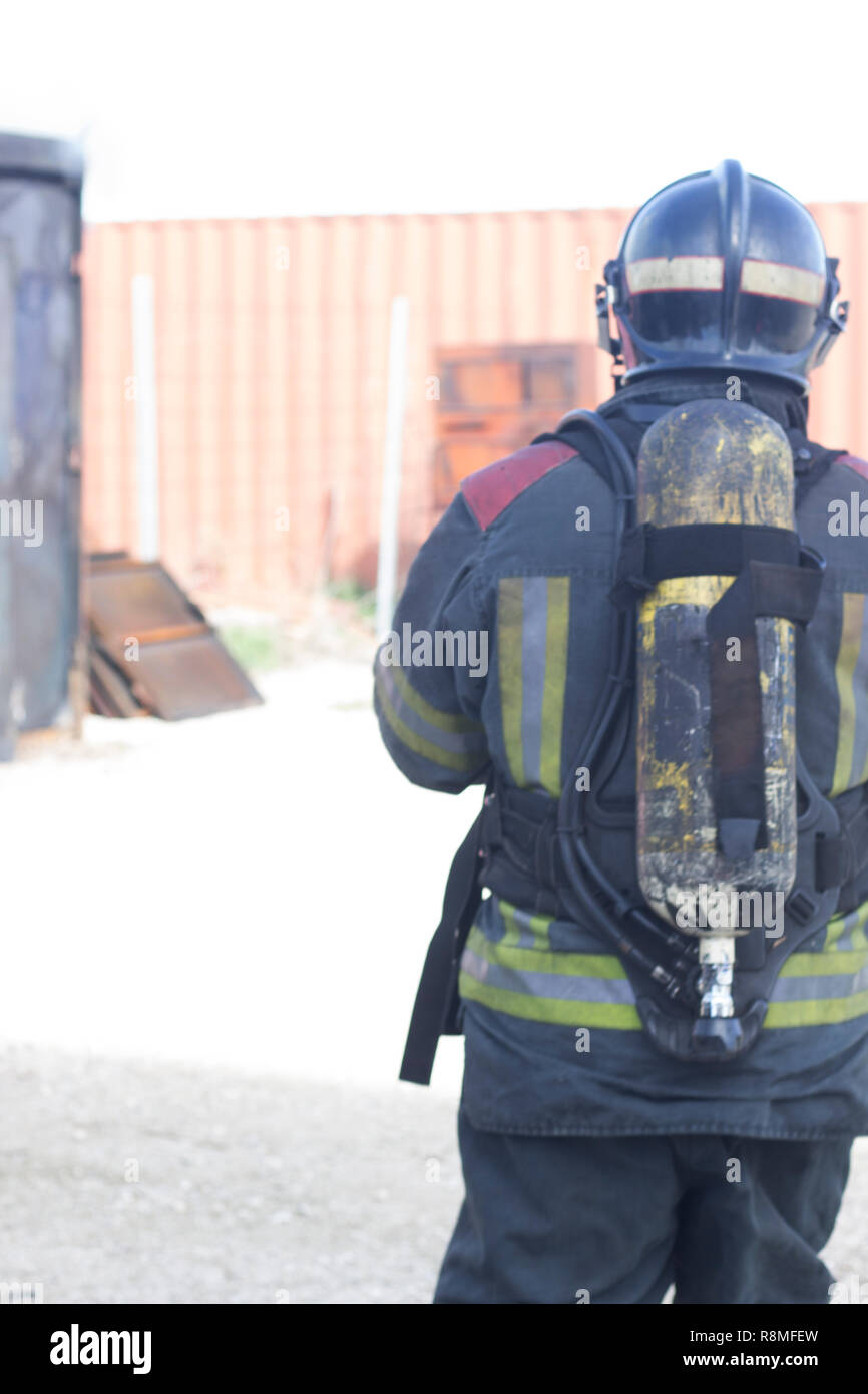 Firefighter putting out fire training station extinguisher backdraft ...
