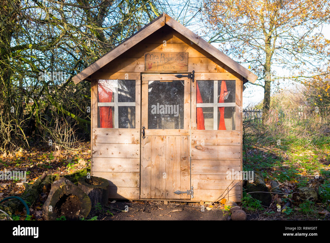 Wooden garden shed outdoor children playhouse Stock Photo - Alamy