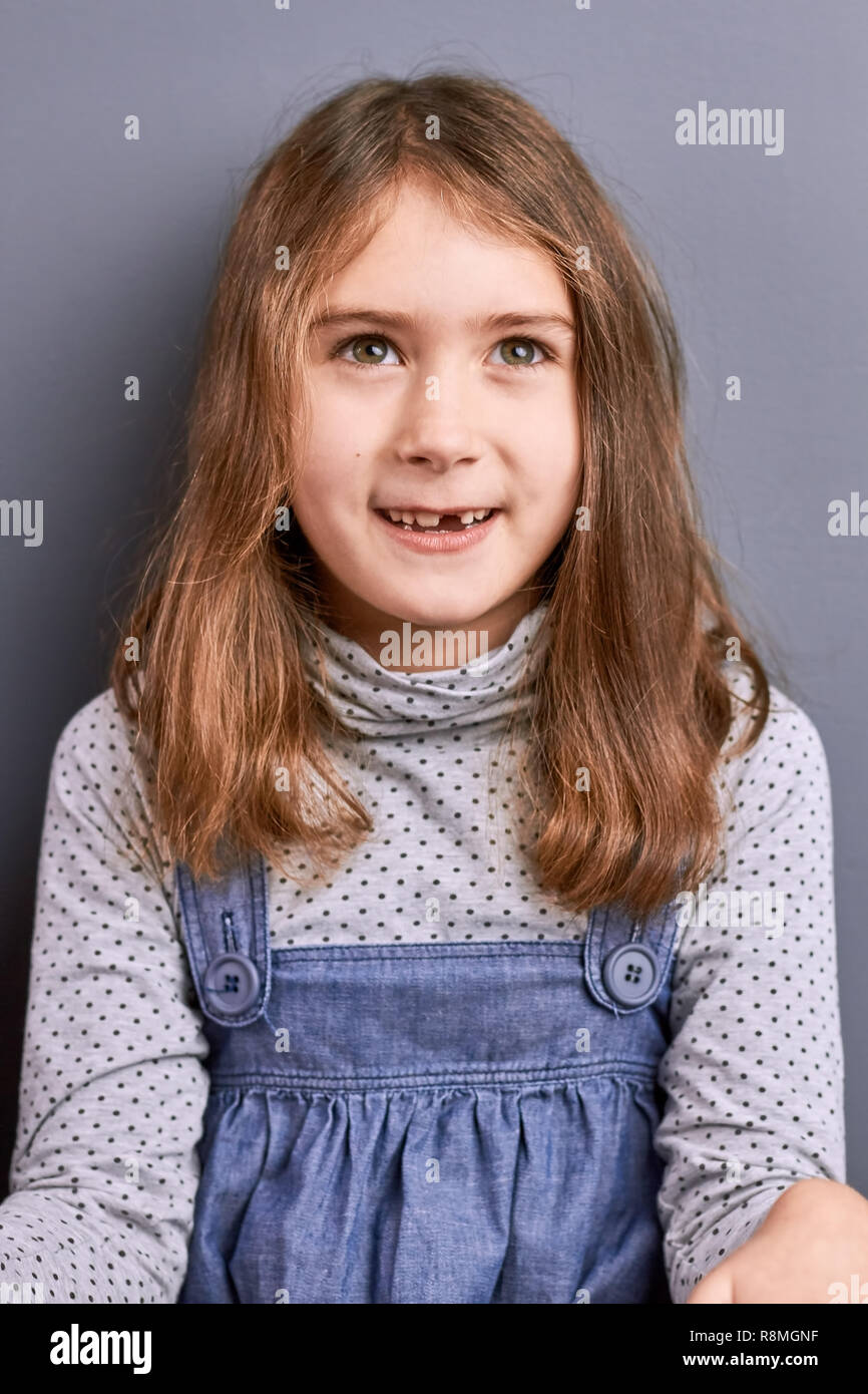 Portrait of little girl looking up Stock Photo - Alamy