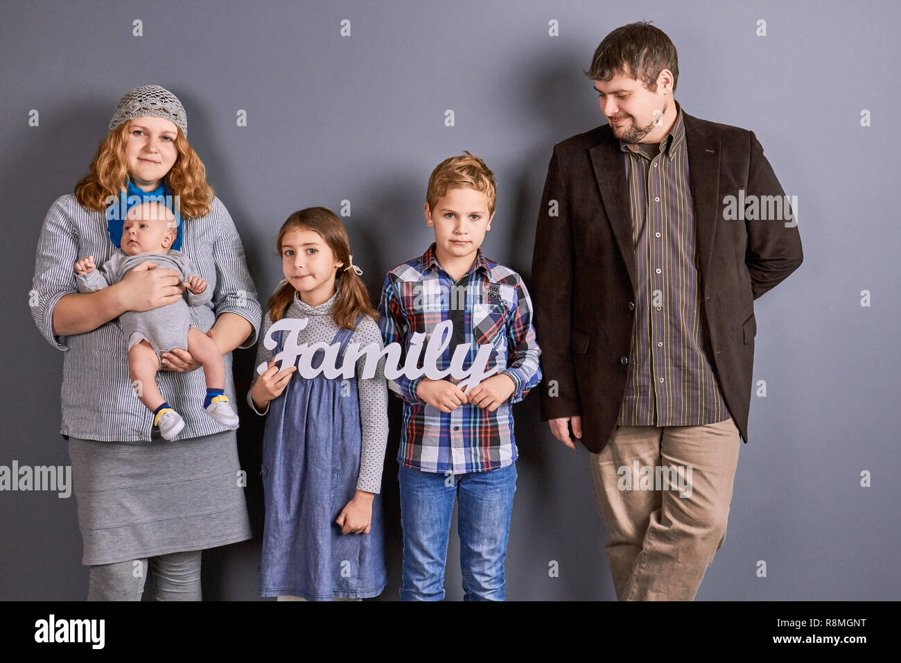 Mother, father and three kids Stock Photo - Alamy