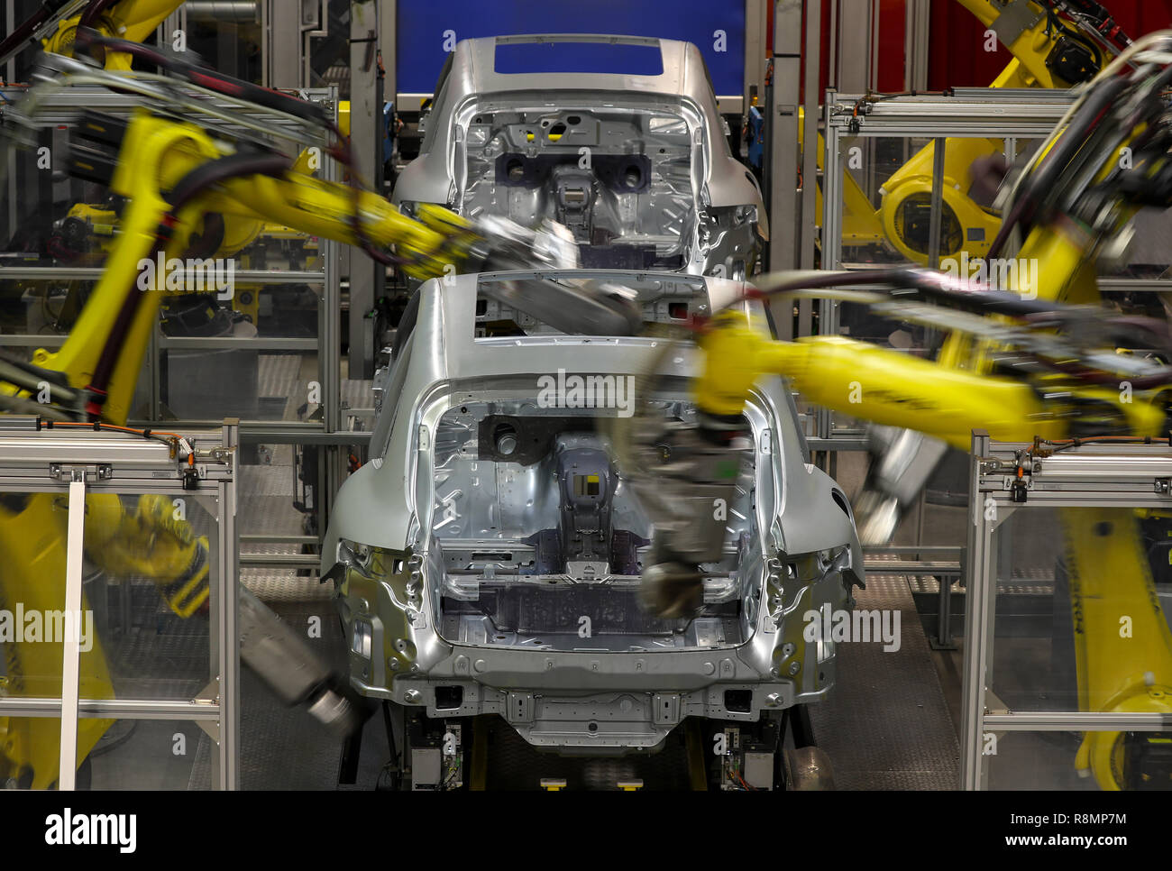 Leipzig, Germany. 13th Dec, 2018. Several welding robots are working on ...