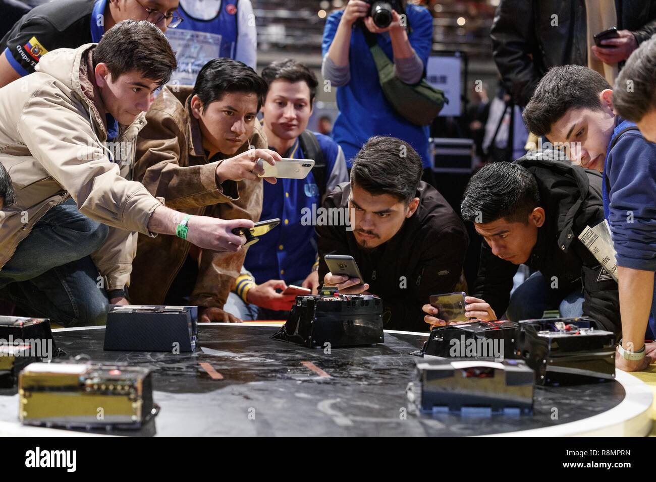 Tokyo, Japan. 16th Dec, 2018. Robot operators take pictures of sumo ...