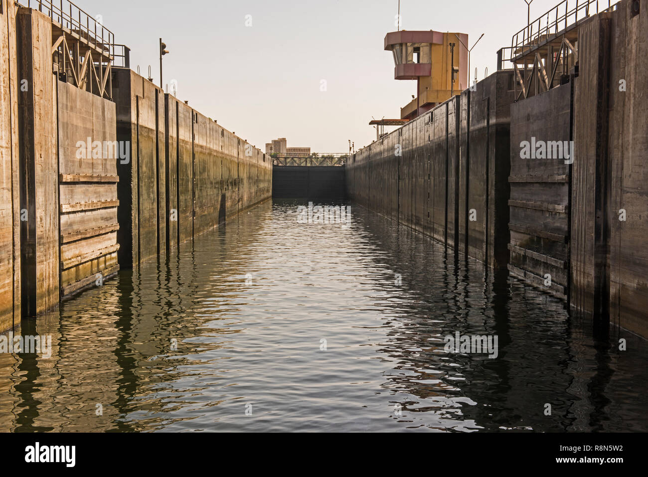 View inside large lock on river Nile in Egypt through Edfu urban ...