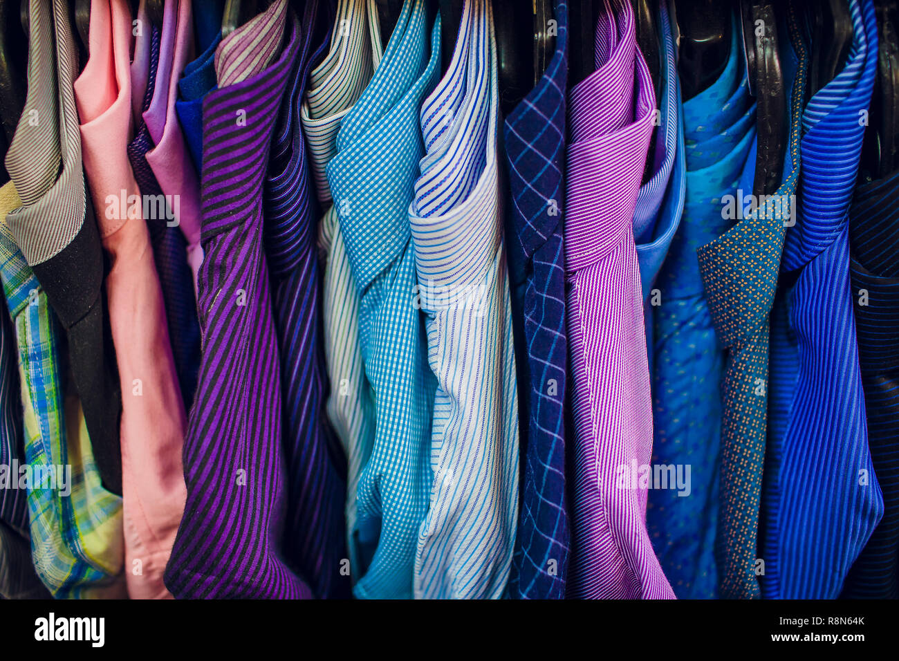 Big Clothing Store Many Rows With Hangers With Pants And T shirts big-clothing-store-many-rows-with-hangers-with-pants-and-t-shirts