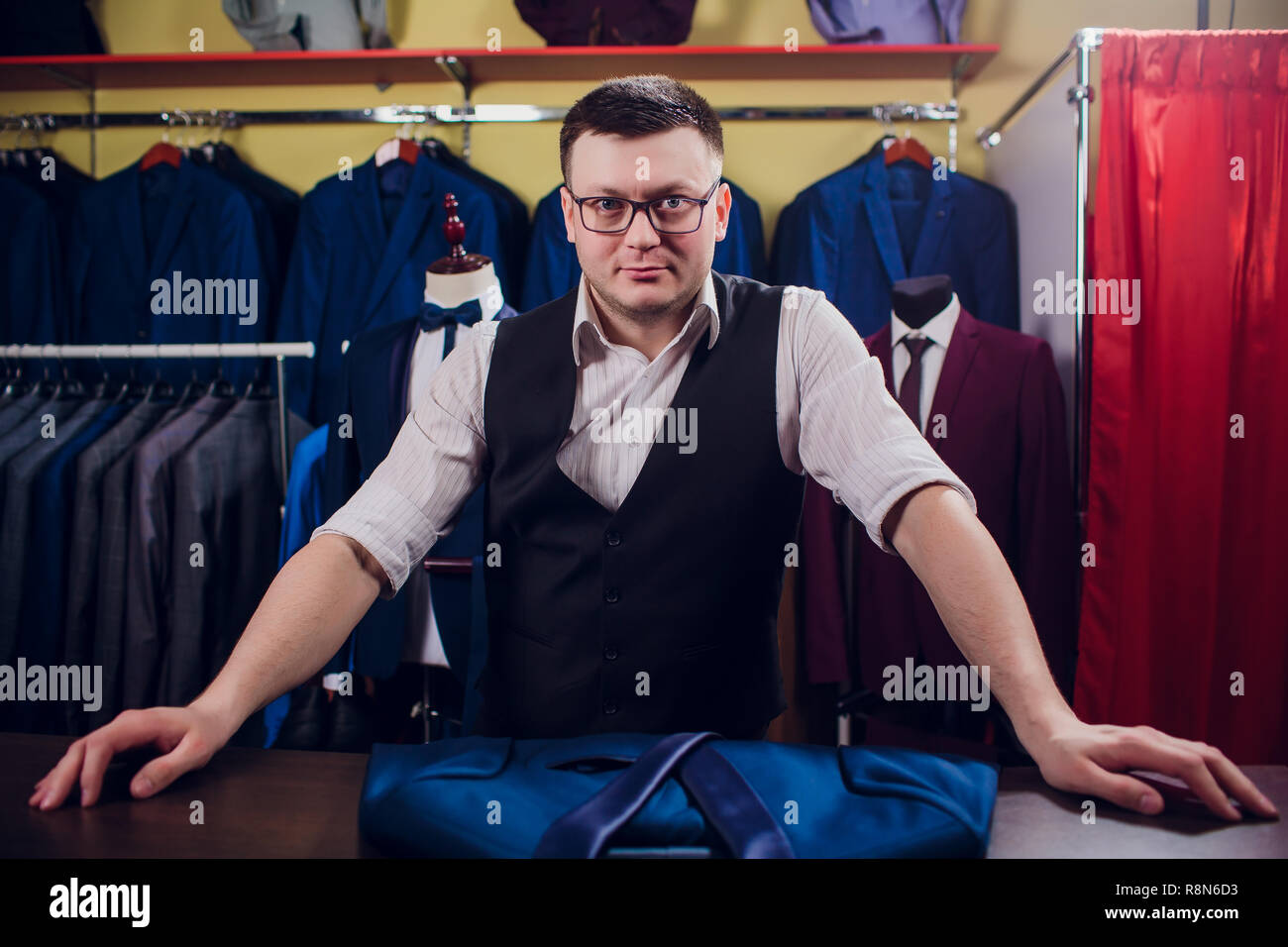 man is buying suit in store Stock Photo - Alamy