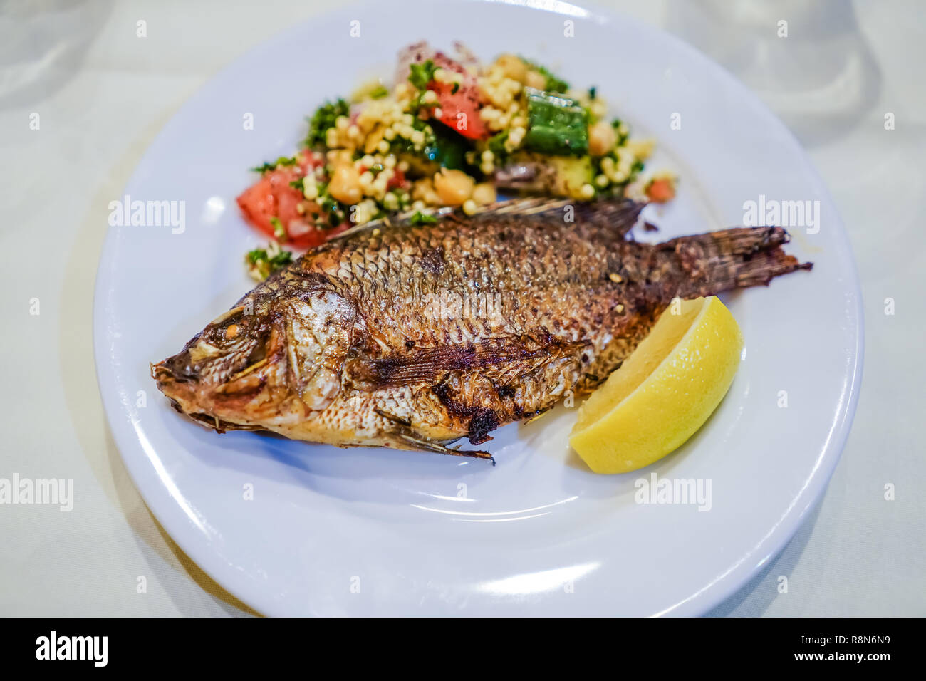 Middle east grilled tilapia hi-res stock photography and images - Alamy