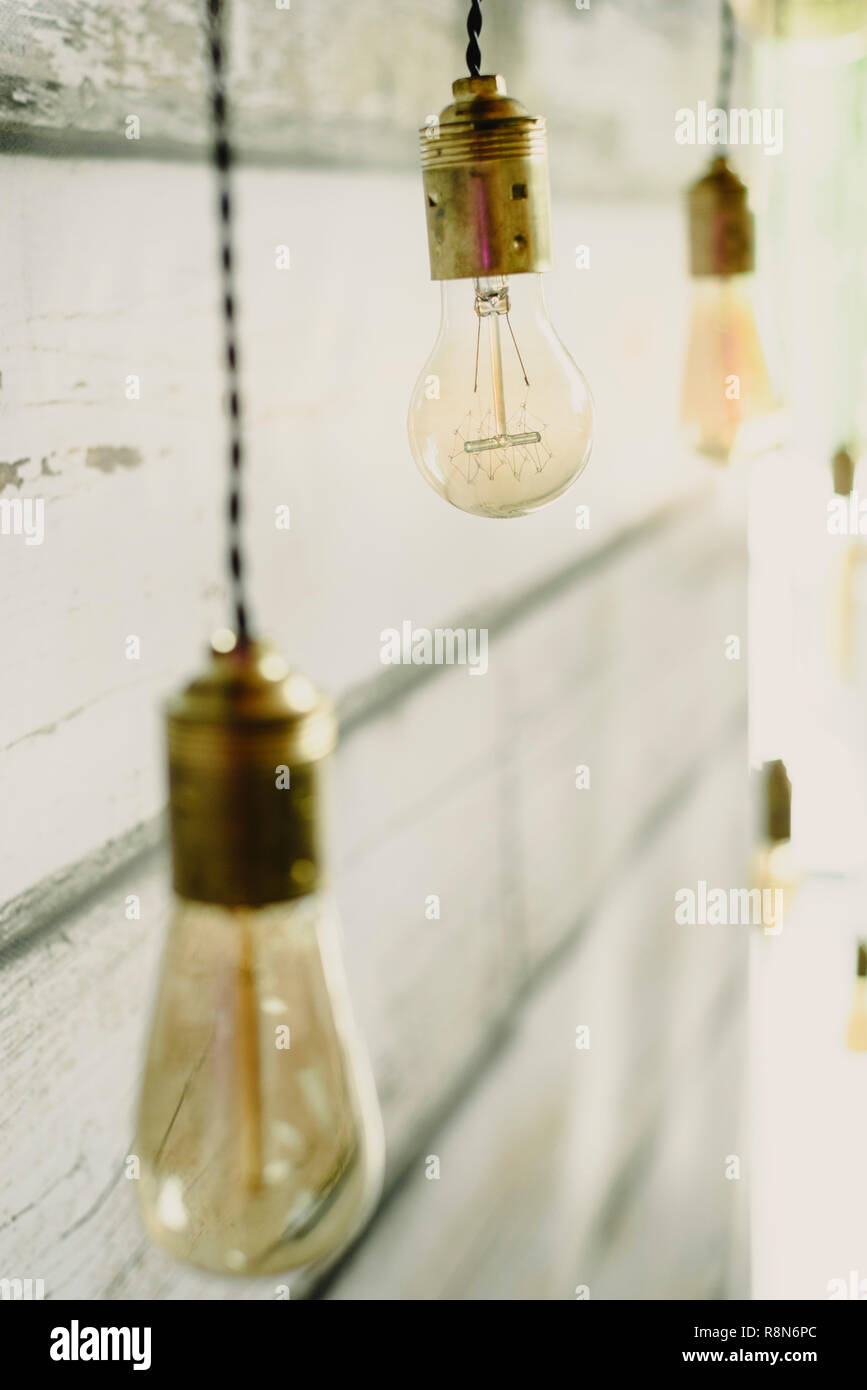 Elongated decoration bulbs hanging from the wooden ceiling Stock Photo ...
