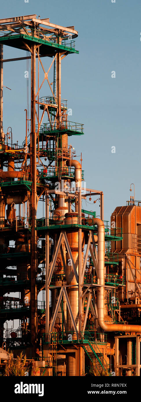 Tubes, pipes and scaffold from an oil refinery - late evening light ...