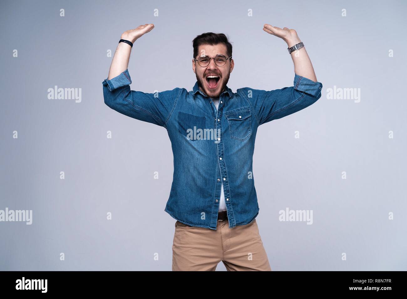 Portrait of successful man showing satisfaction isolated Stock Photo ...