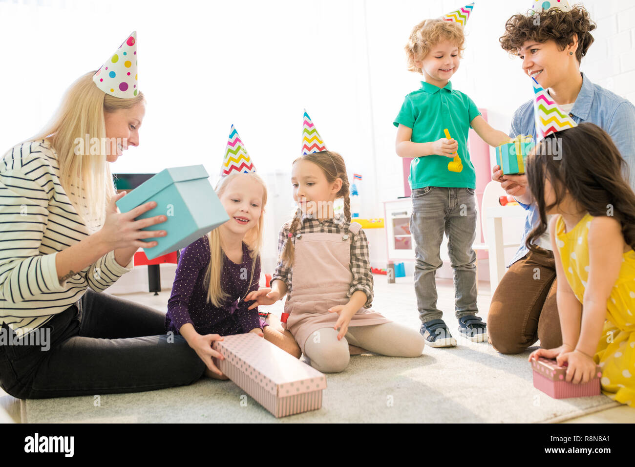Kid guessing inside the box hi-res stock photography and images - Alamy