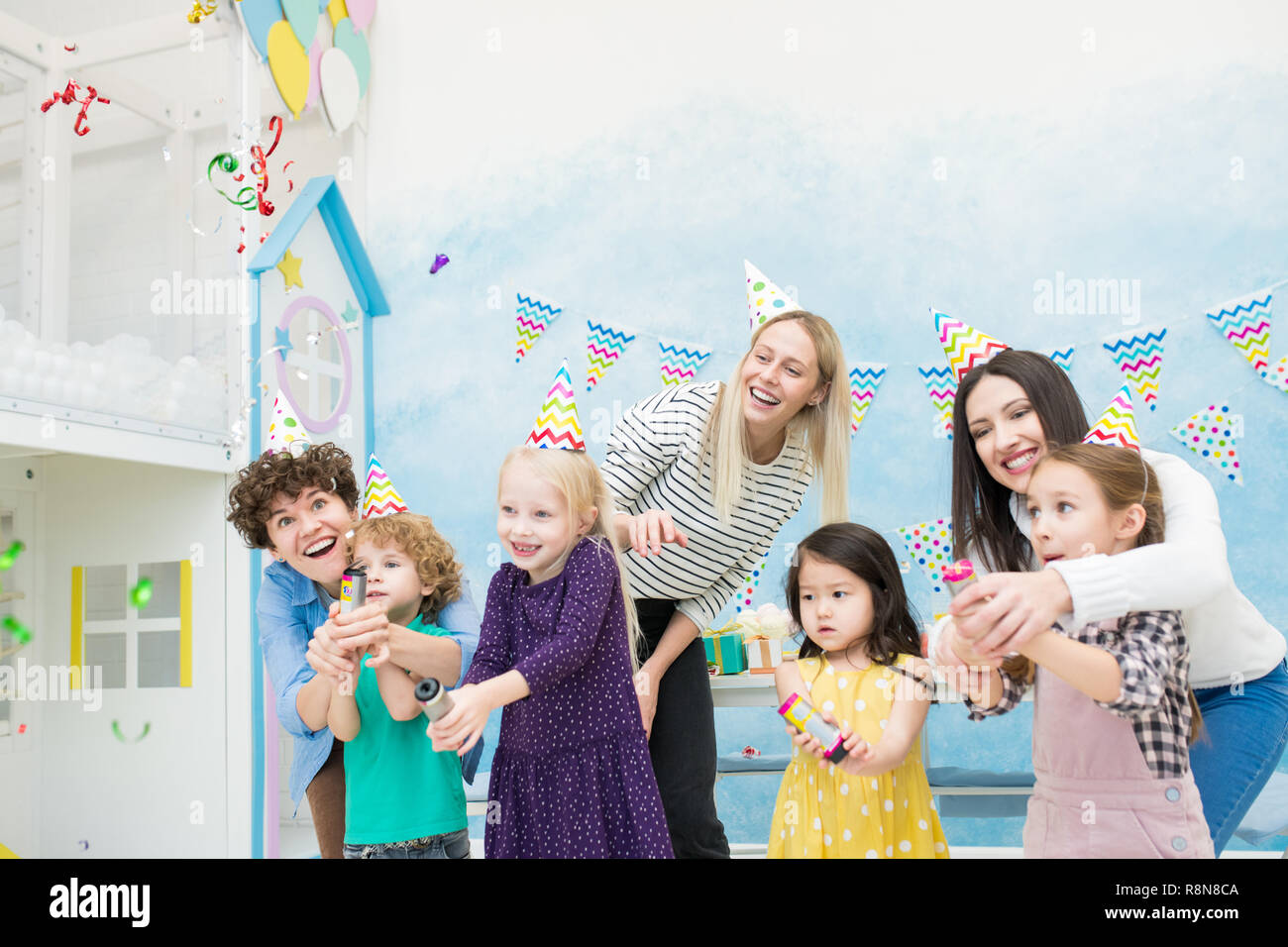 Ecstatic mothers and children bursting crackers Stock Photo - Alamy Ecstatic mothers and children bursting crackers Stock Photo - Alamy