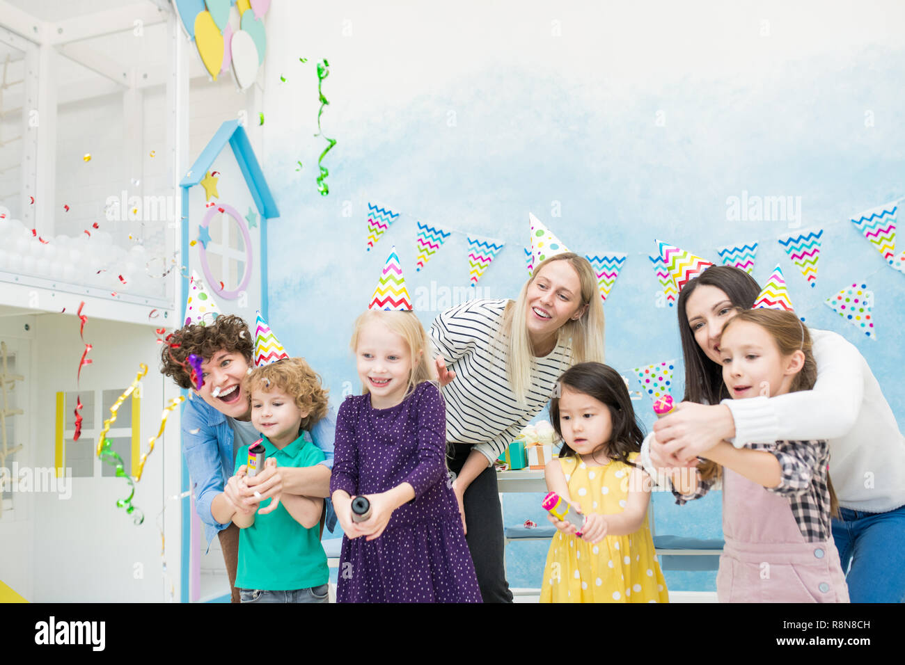 Emotional mothers helping kids to burst crackers Stock Photo - Alamy Emotional mothers helping kids to burst crackers Stock Photo - Alamy