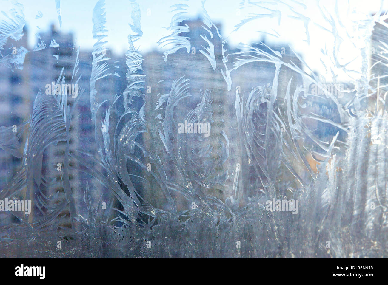 Frozen winter window with shiny ice frost pattern texture. Christmas ...