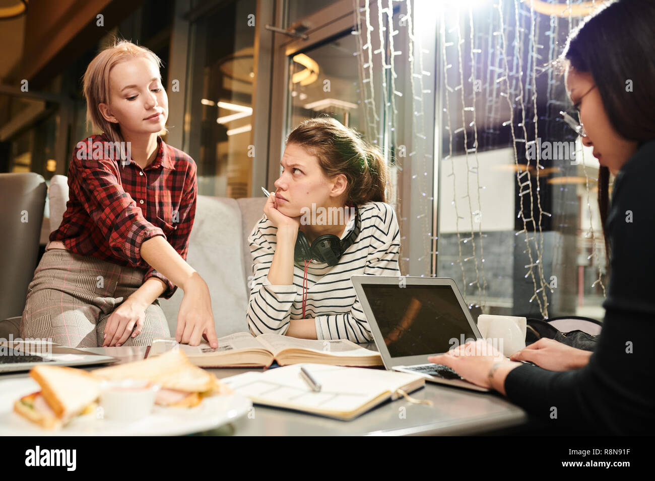Doing homework in group Stock Photo - Alamy