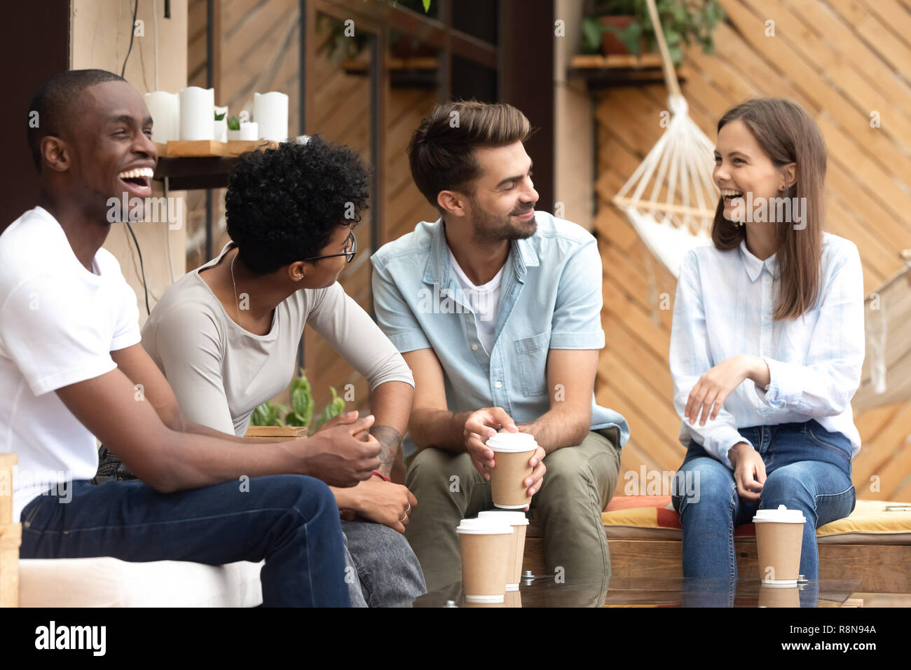 Diverse friends having fun together, laughing at joke Stock Photo - Alamy