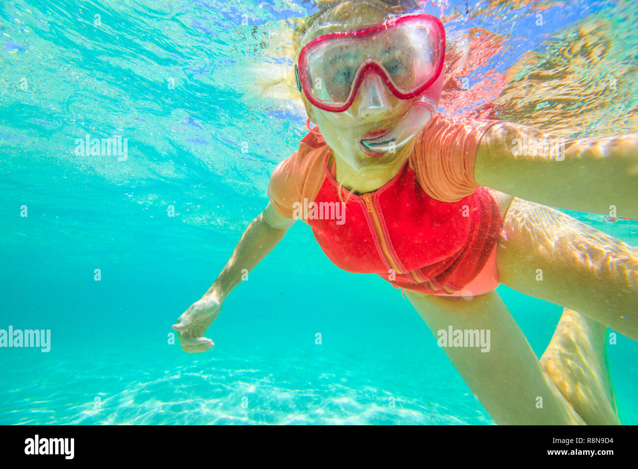 Woman wetsuit snorkel hi-res stock photography and images - Alamy