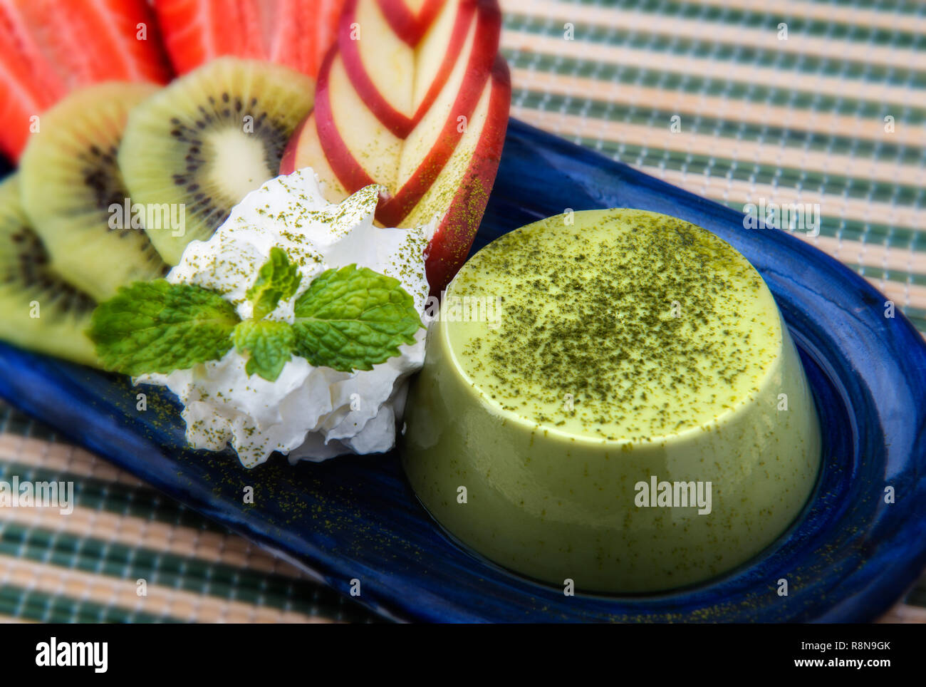 Matcha custard pudding serve with fruits topping Stock Photo - Alamy