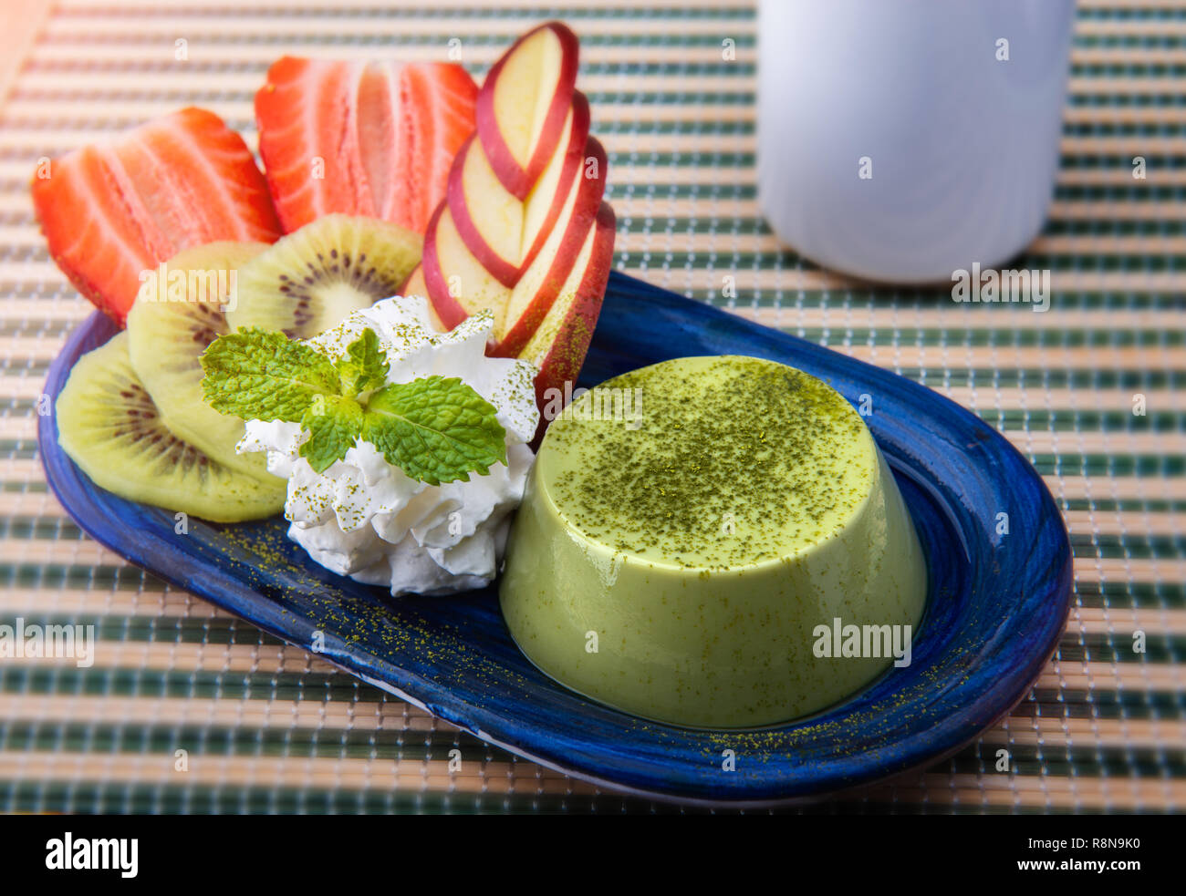 Matcha custard pudding serve with fruits topping Stock Photo - Alamy