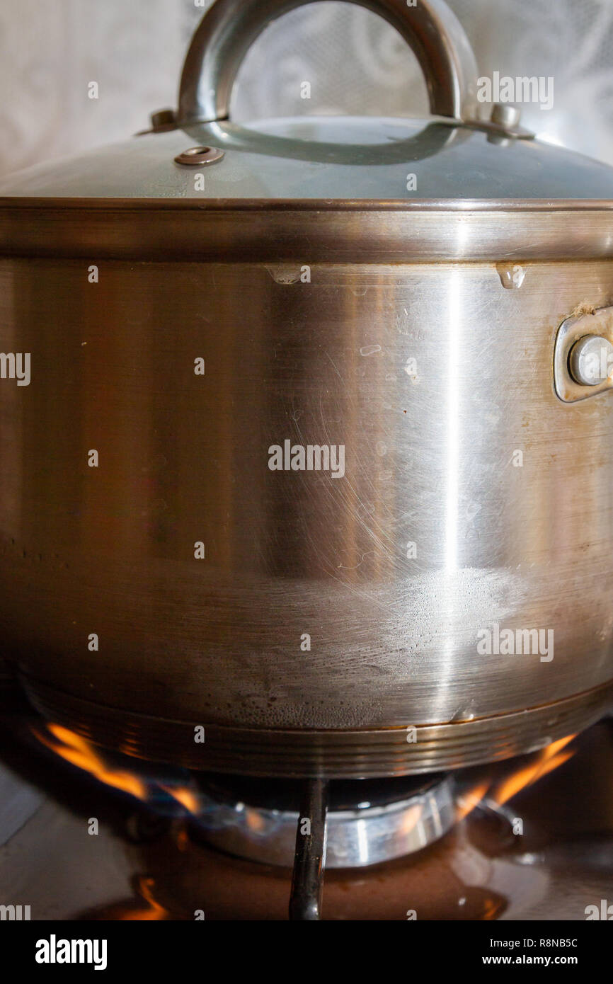 The pan is made of metal standing on a gas stove Stock Photo - Alamy