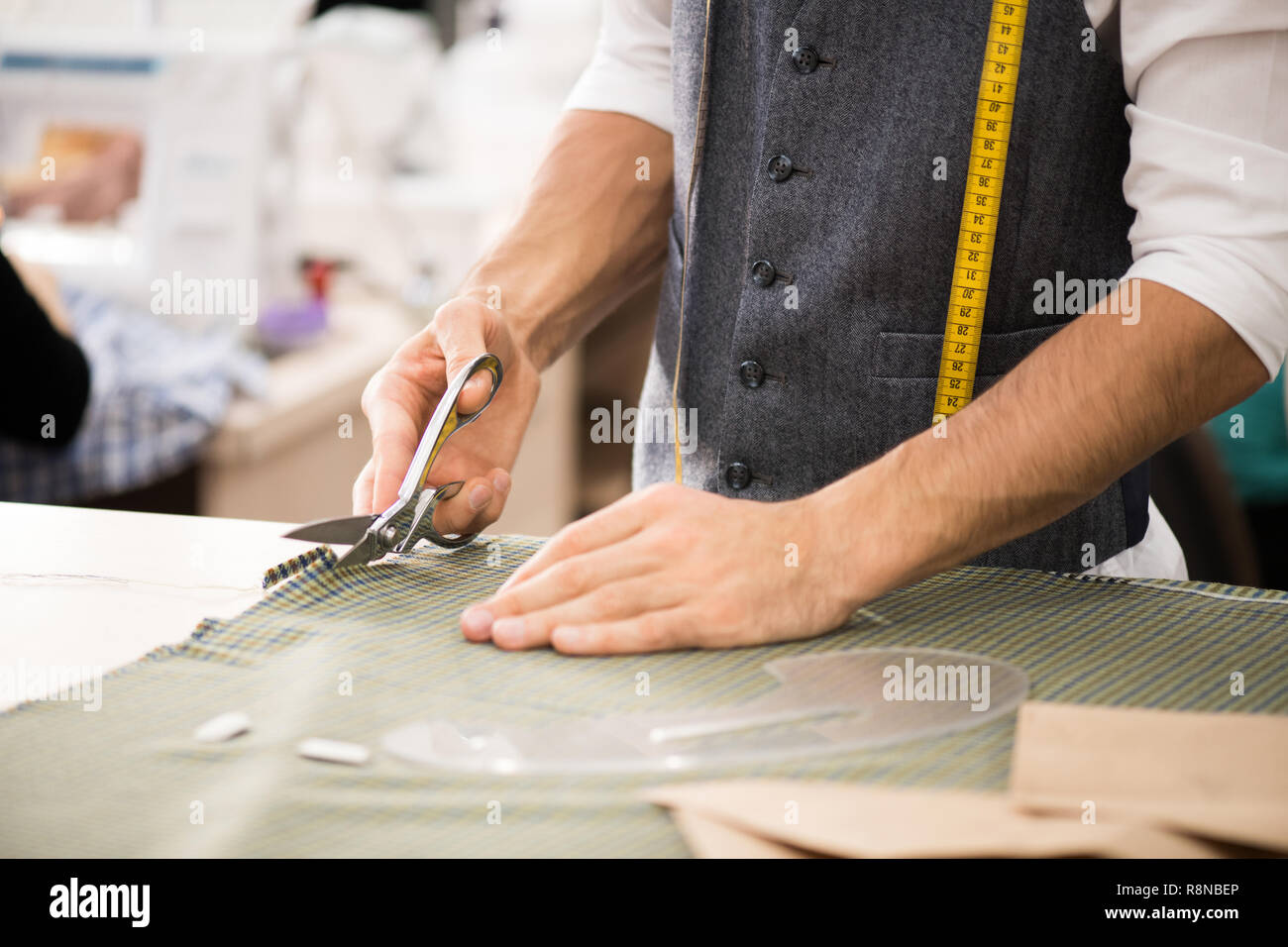 Scissors cutting clothes hi-res stock photography and images - Alamy