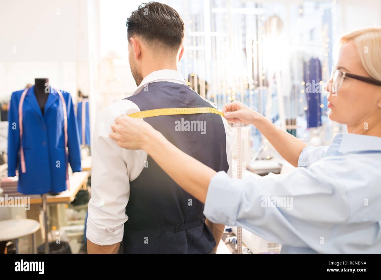 Handsome tailor measuring jacket hi-res stock photography and images ...