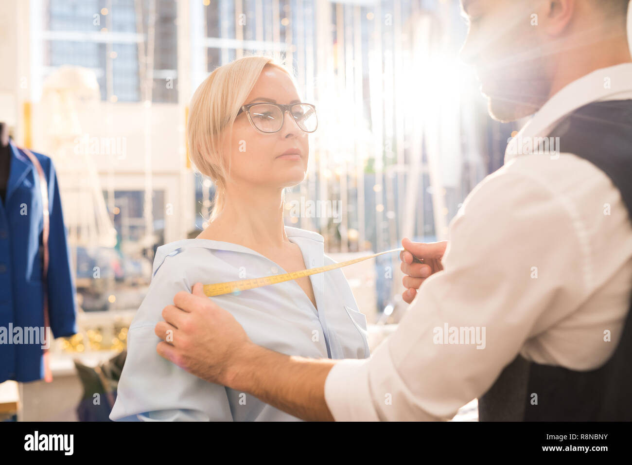 Male Tailor Measuring Client Stock Photo - Alamy
