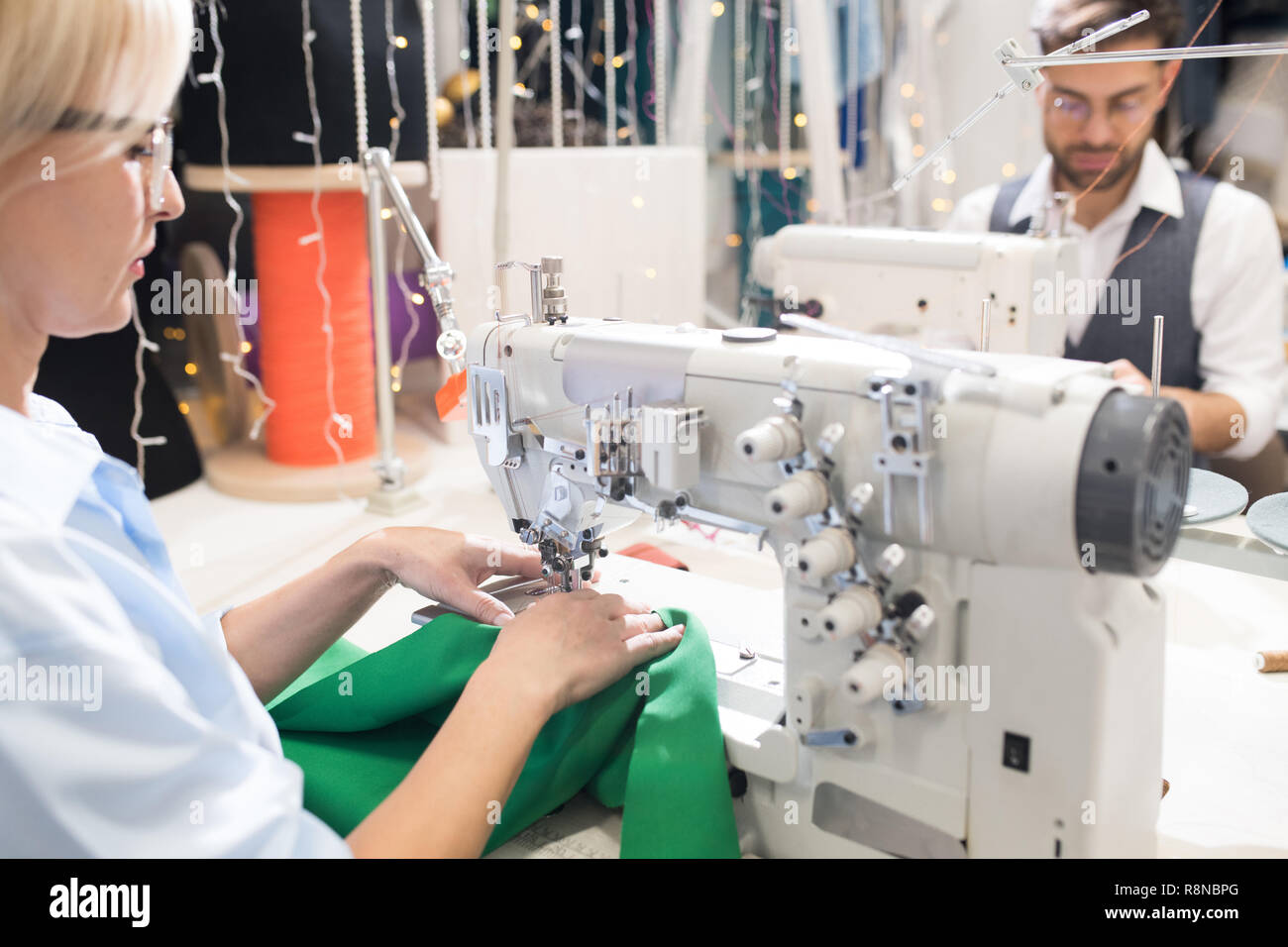 Seamstress at Sewing Machine Stock Photo - Alamy