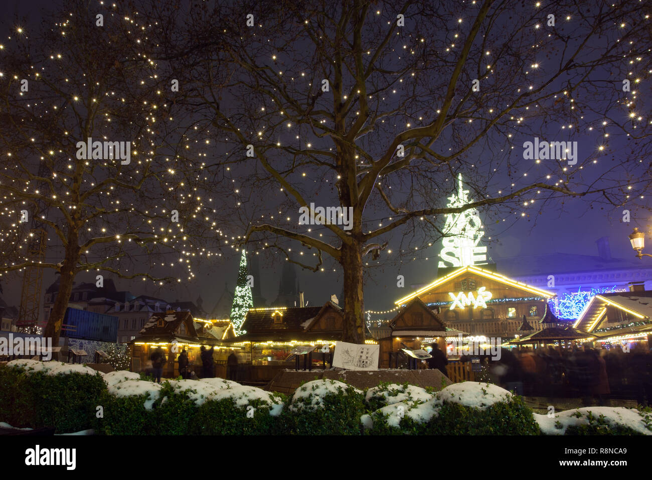 Christmas market covered with snow and mist Stock Photo - Alamy