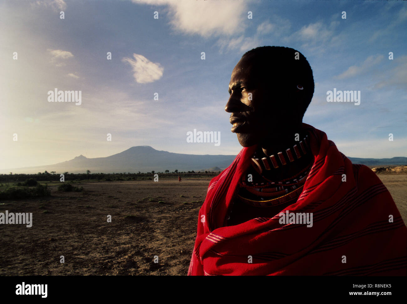 Masai tribesmen with Mt. Kilimanjaro in the background, Amboseli Game ...