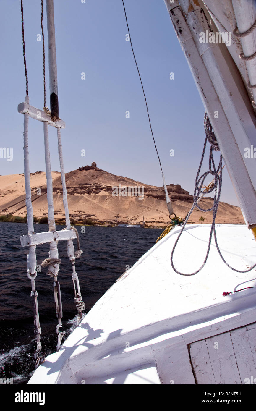 View from a traditional Egyptian felucca (boat) approaching the Tombs ...