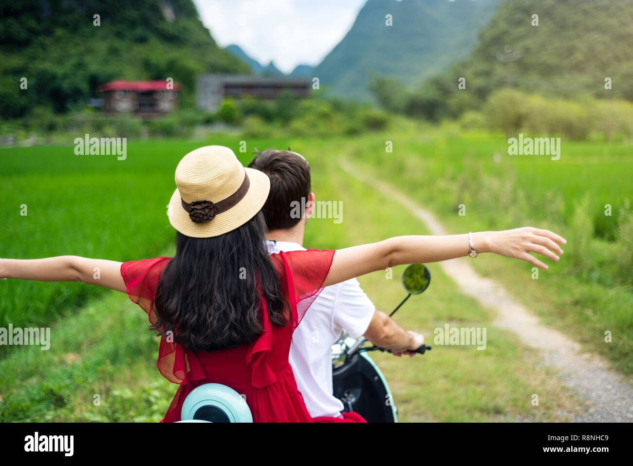 Couple riding motorbike around rice fields of Yangshuo in China Stock ...
