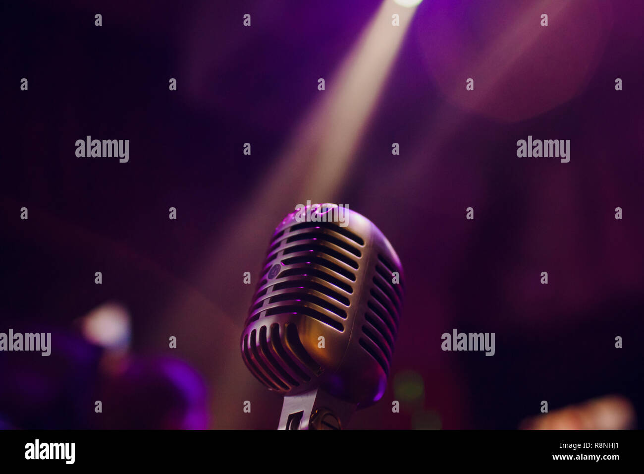 microphone on stand up comedy stage with reflectors ray, high contrast ...