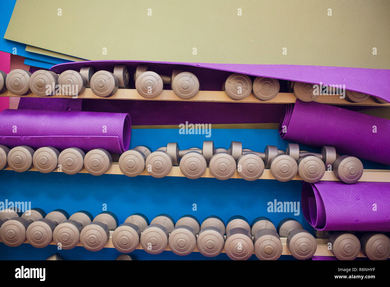 dumbbell, barbell. Background many color weights Stock Photo - Alamy