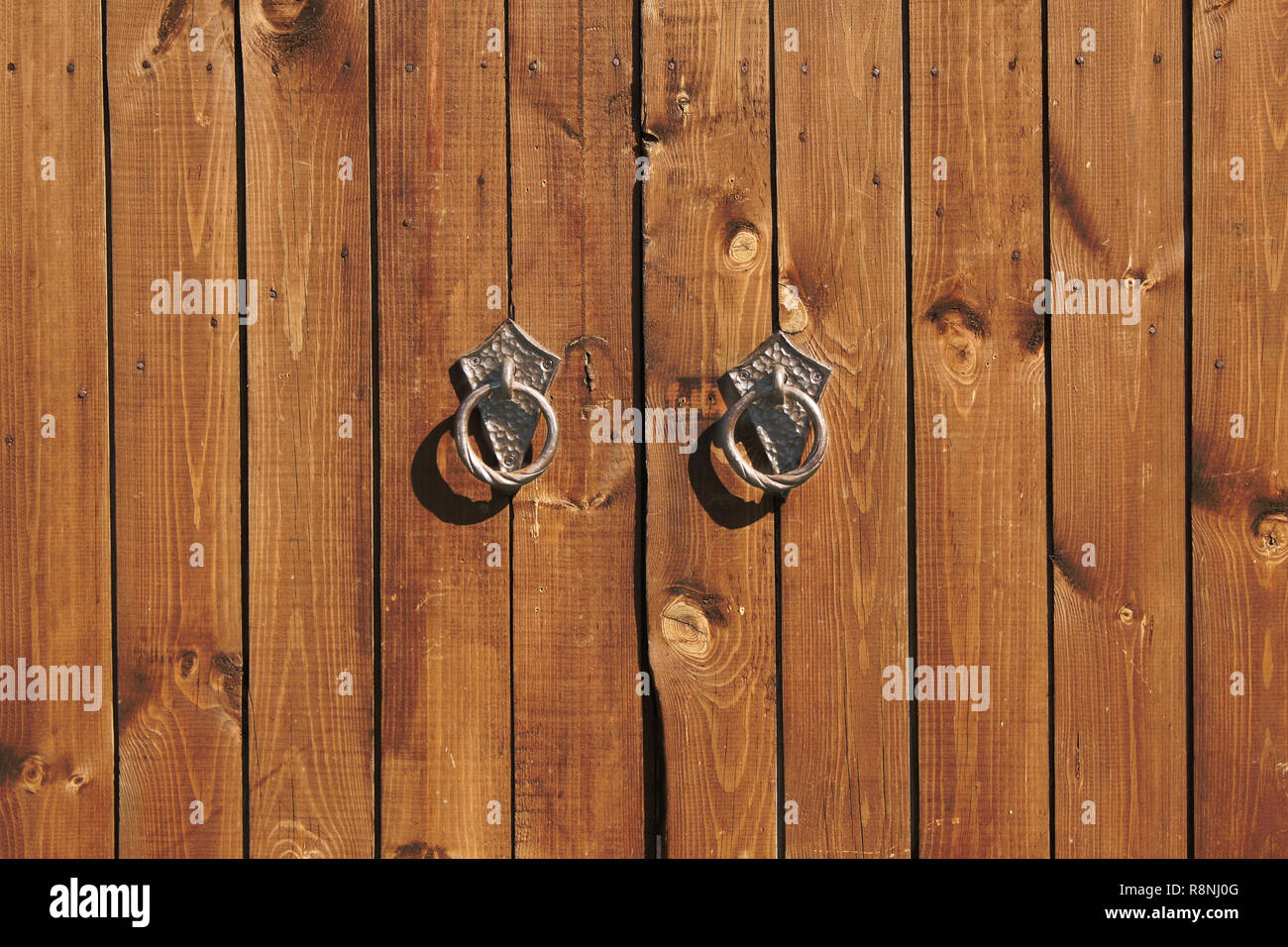 Ancient wooden gate with metal handles Stock Photo - Alamy