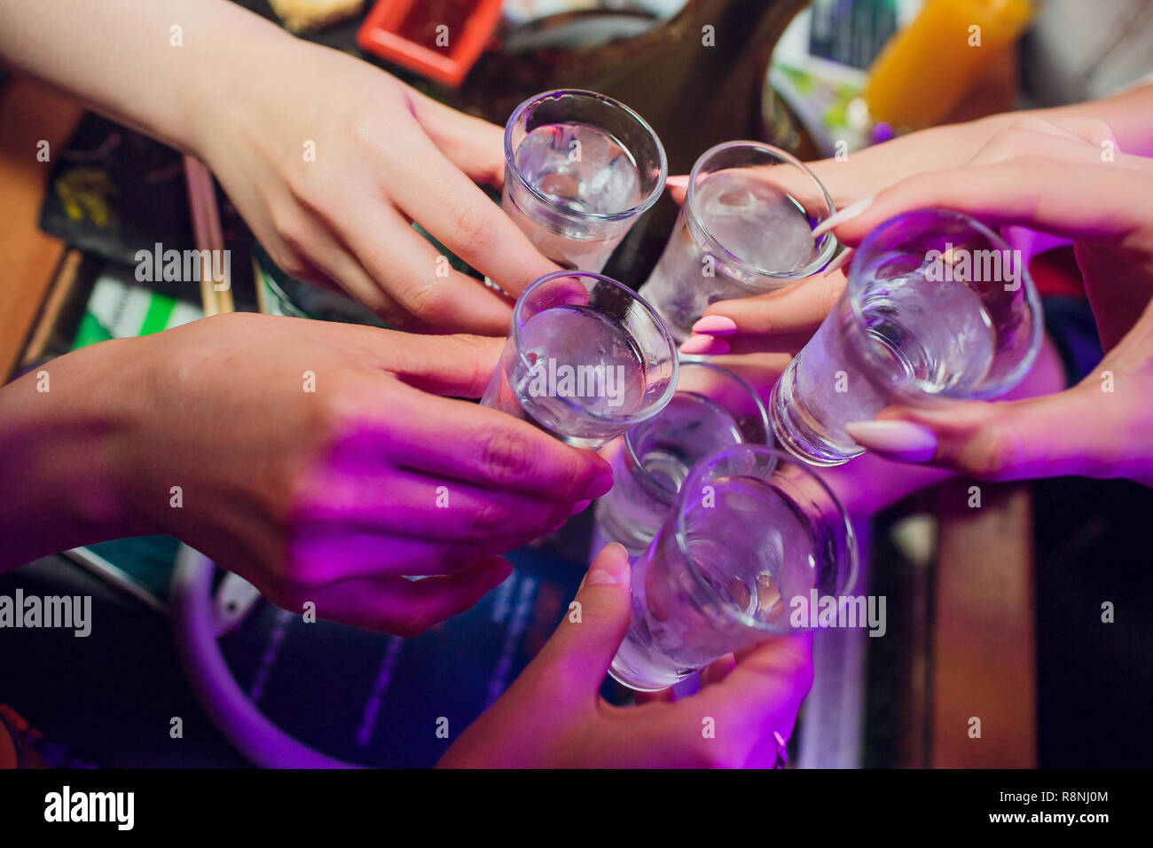 People Clinging Drinks Together raise toast hand Stock Photo - Alamy
