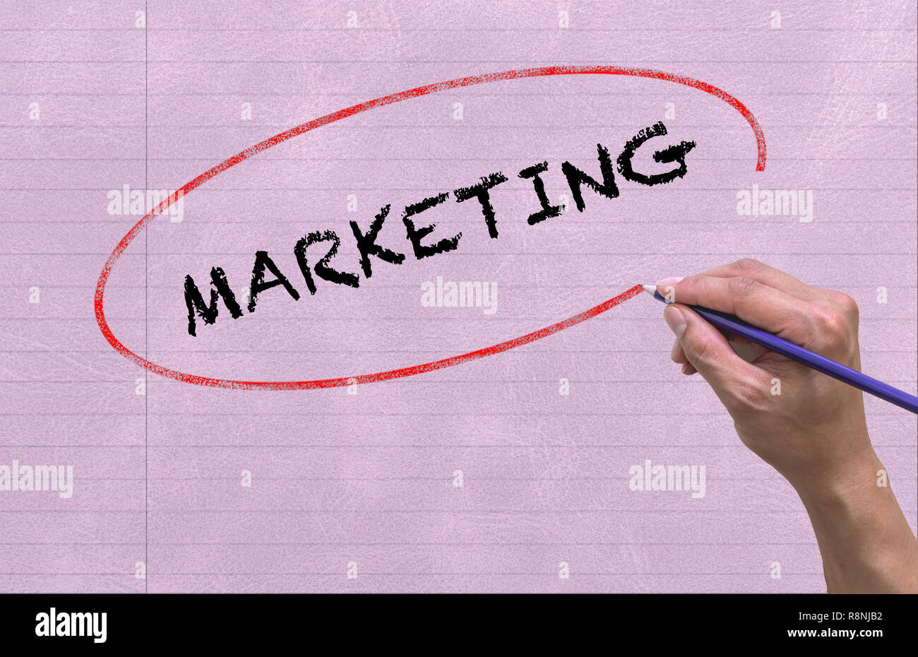 Hand writing Marketing by pencil on paper Notebook background. Business ...
