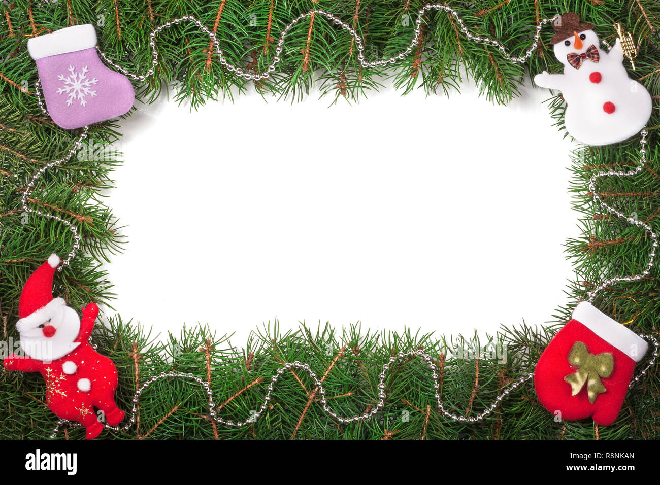 Christmas frame made of fir branches decorated with Santa Claus and ...
