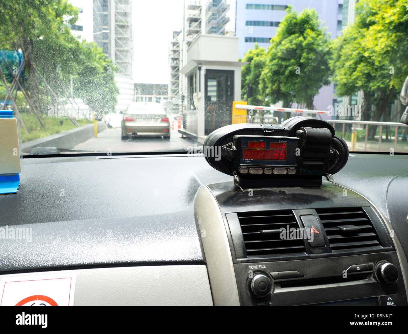 View from cab with meter display Time, Distance and Fare in dashboard ...